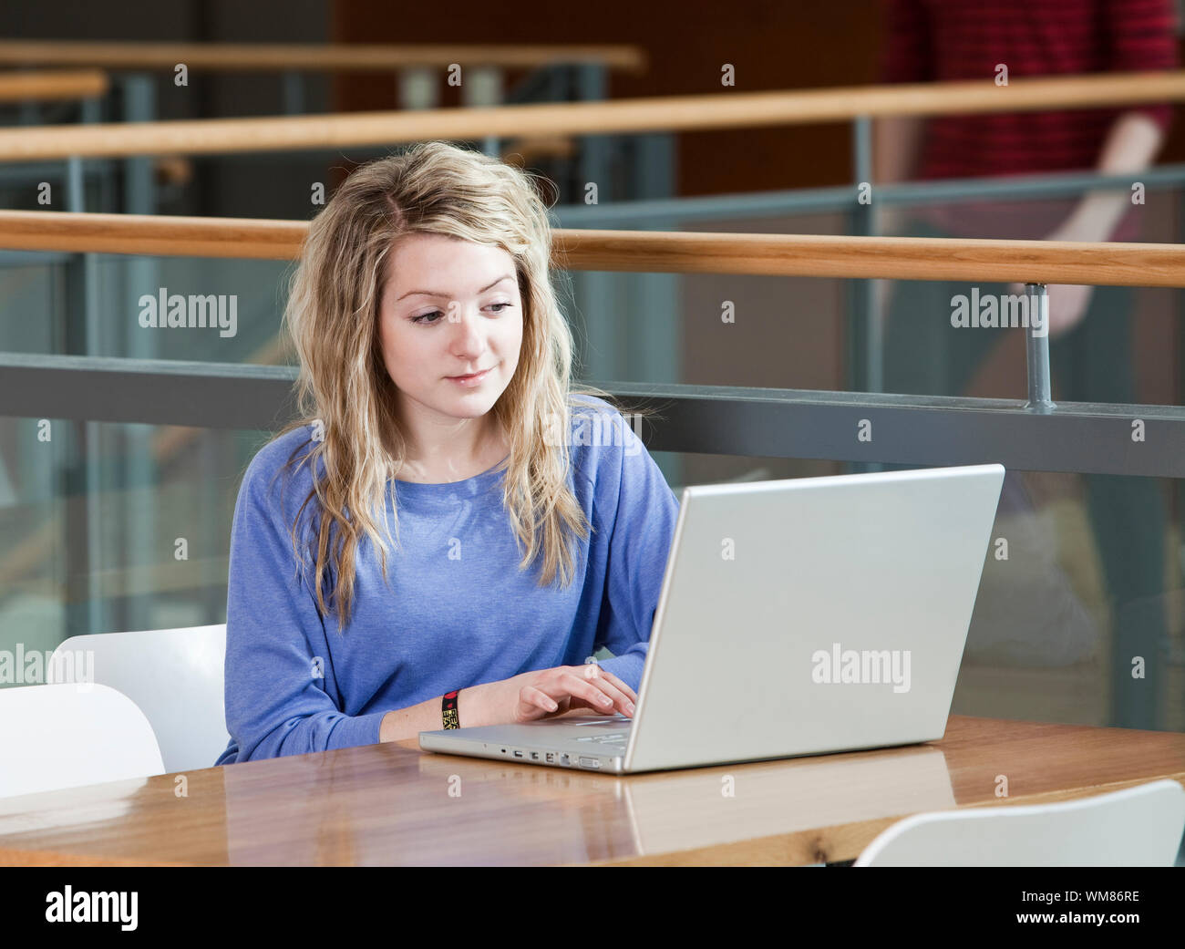 Girl with a computer Stock Photo - Alamy