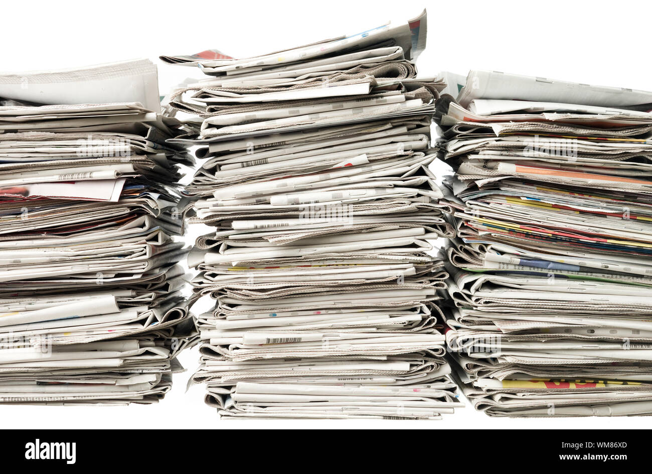 Three piles of newspapers Stock Photo - Alamy
