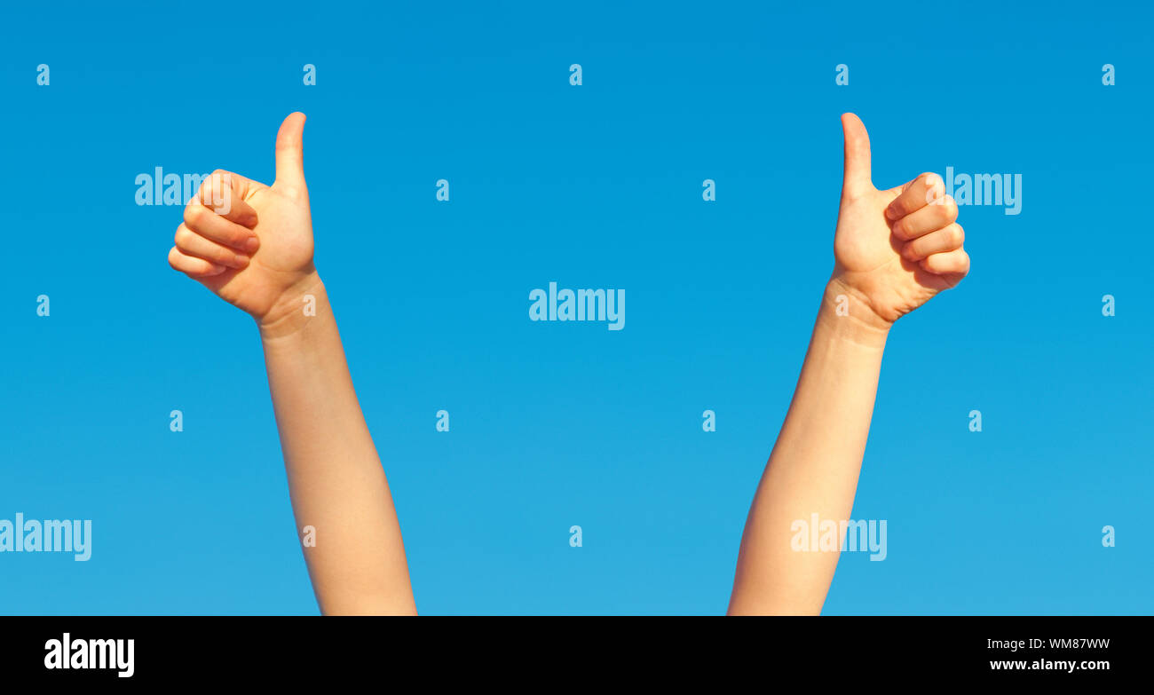A photography of two hands thumbs up Stock Photo - Alamy