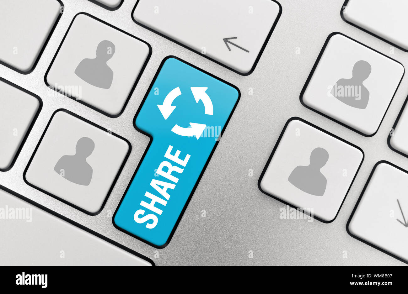 Share concept on modern aluminum keyboard Stock Photo - Alamy