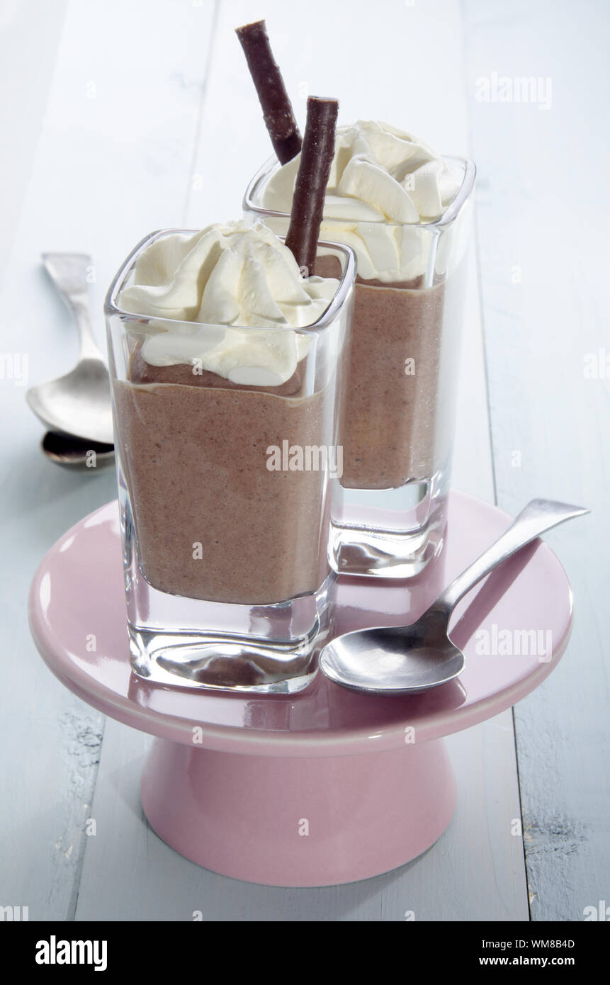 chocolate dessert with whipped cream and sweet chocolate sticks Stock ...