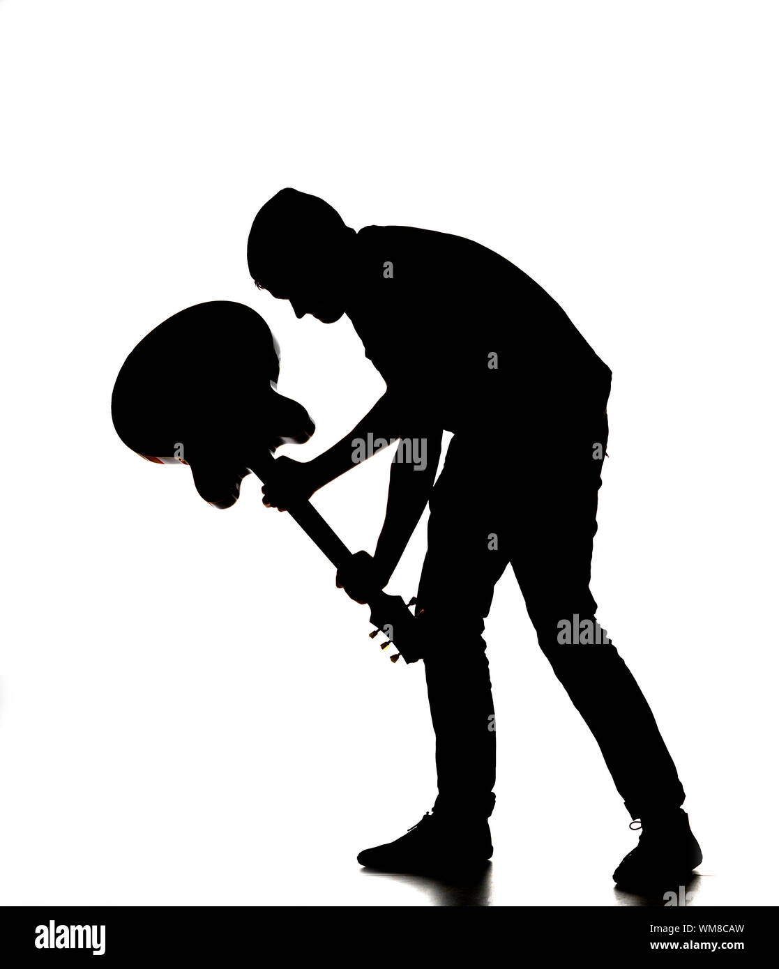 silhouette of a man smashing his guitar Stock Photo - Alamy