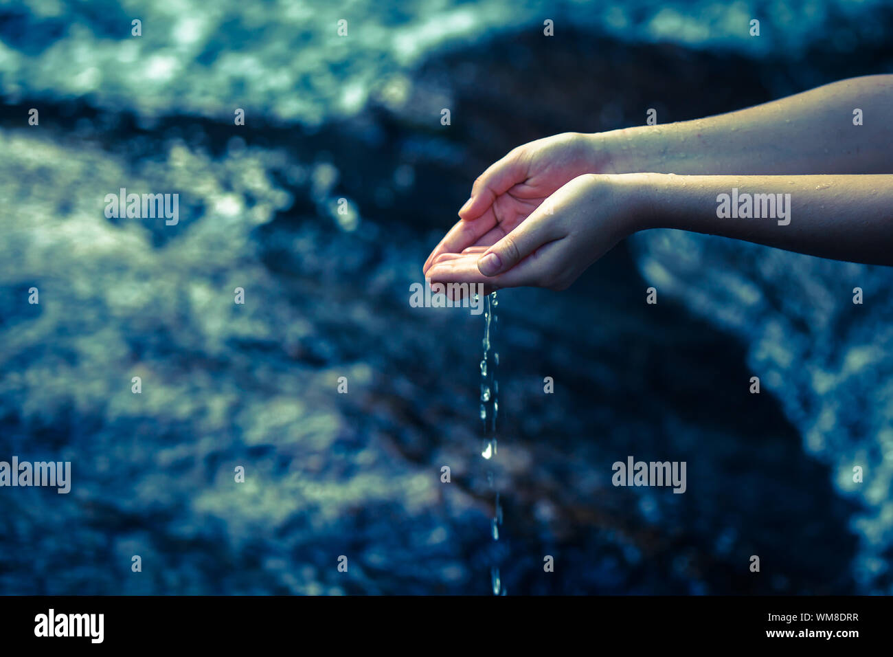 Woman pouring water hi-res stock photography and images - Alamy