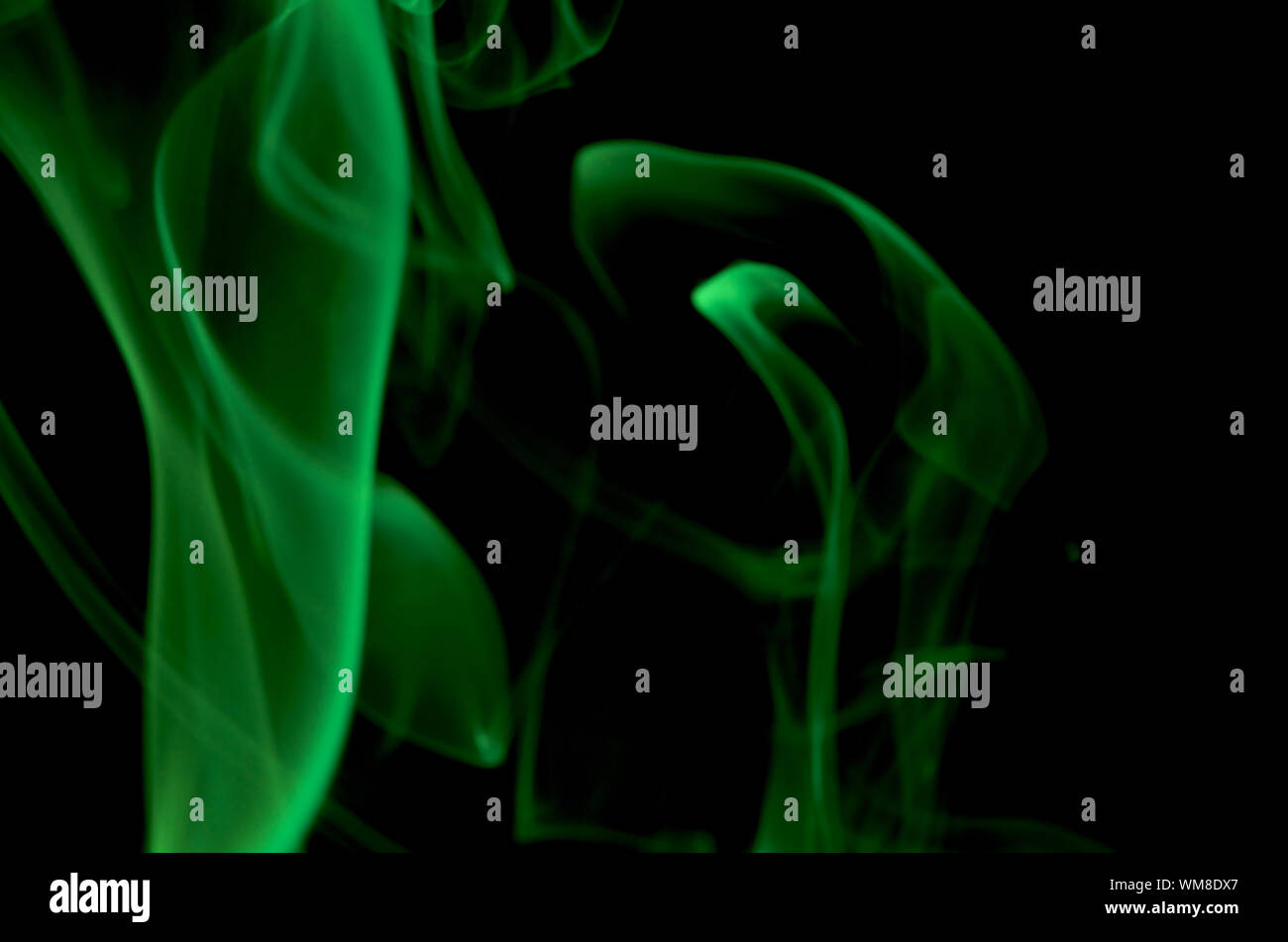 Abstract Green Smoke Figures on Black background Stock Photo - Alamy