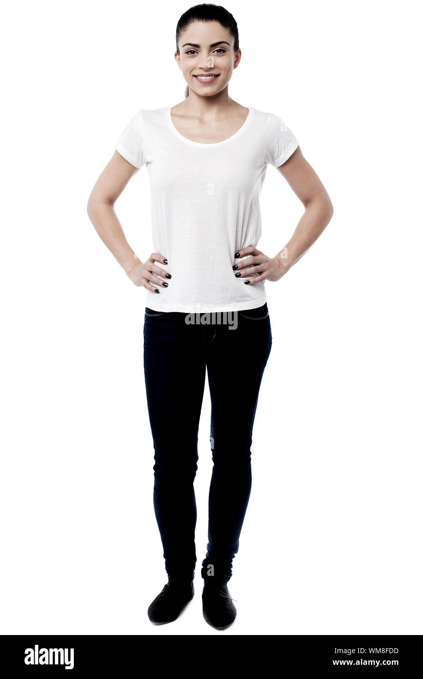 Casual woman posing with hands on her hip Stock Photo - Alamy