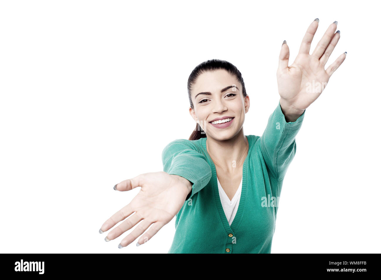 Young woman trying to catch something on air Stock Photo - Alamy