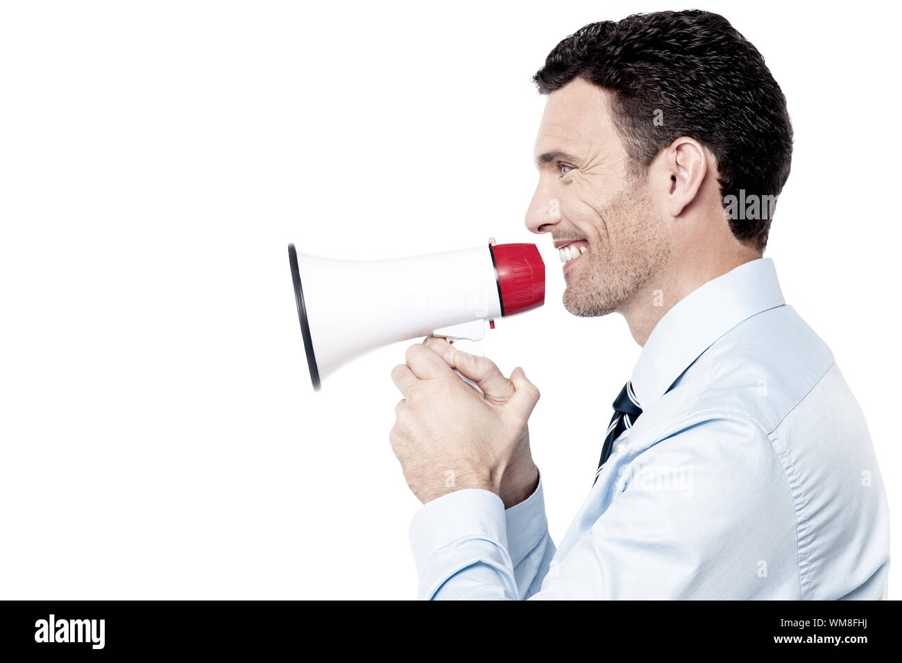 Corporate man making announcement with loudhailer Stock Photo - Alamy