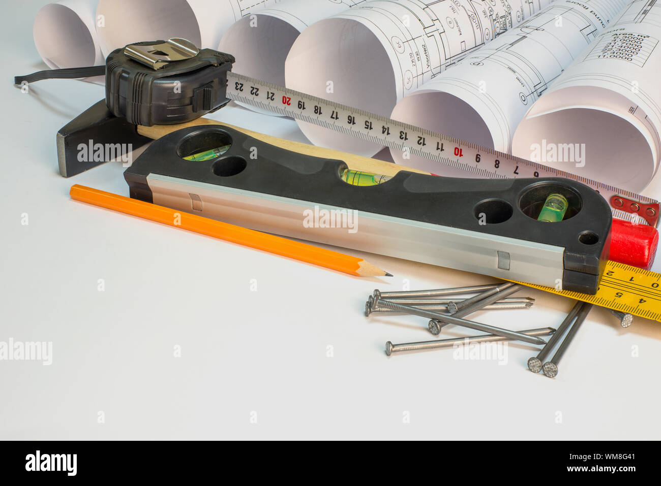 Drawing rolls, hammer, nails, builder's level, pencil, ruler and tape ...