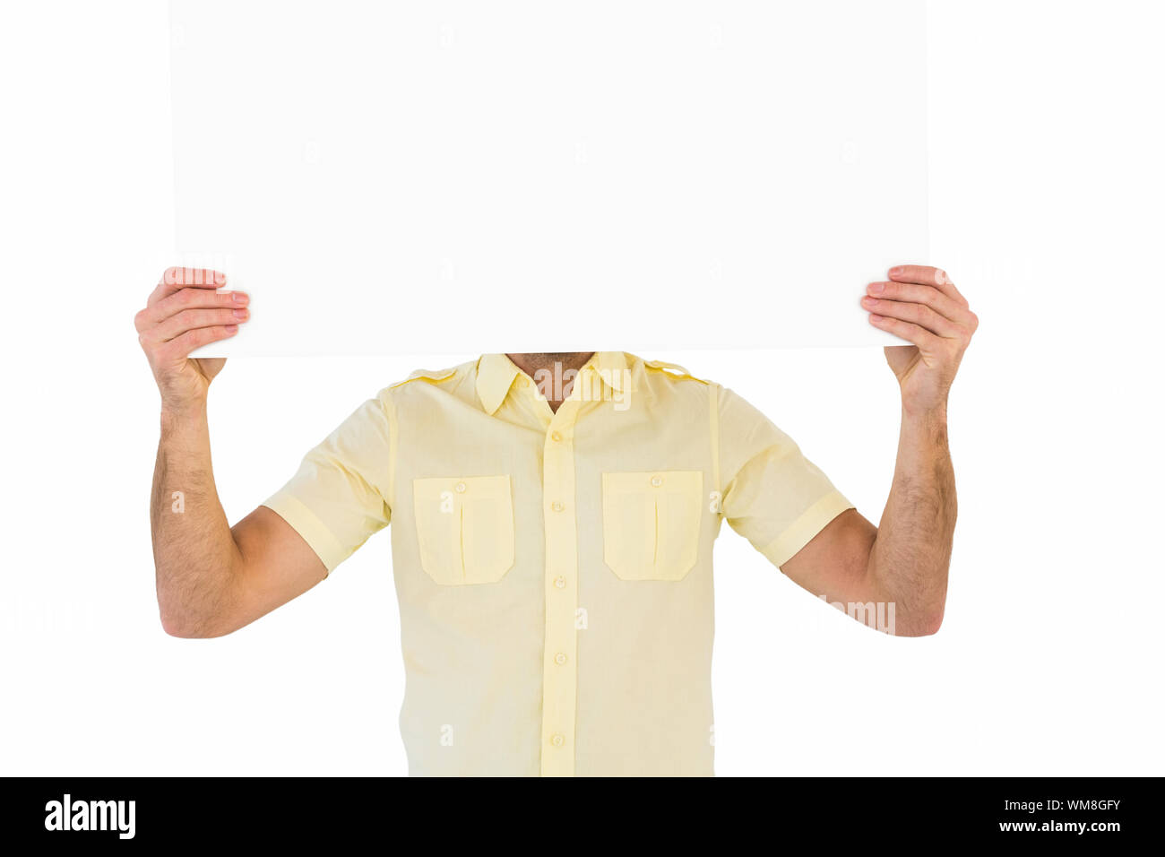Man holding card in front of his face on white background Stock Photo ...