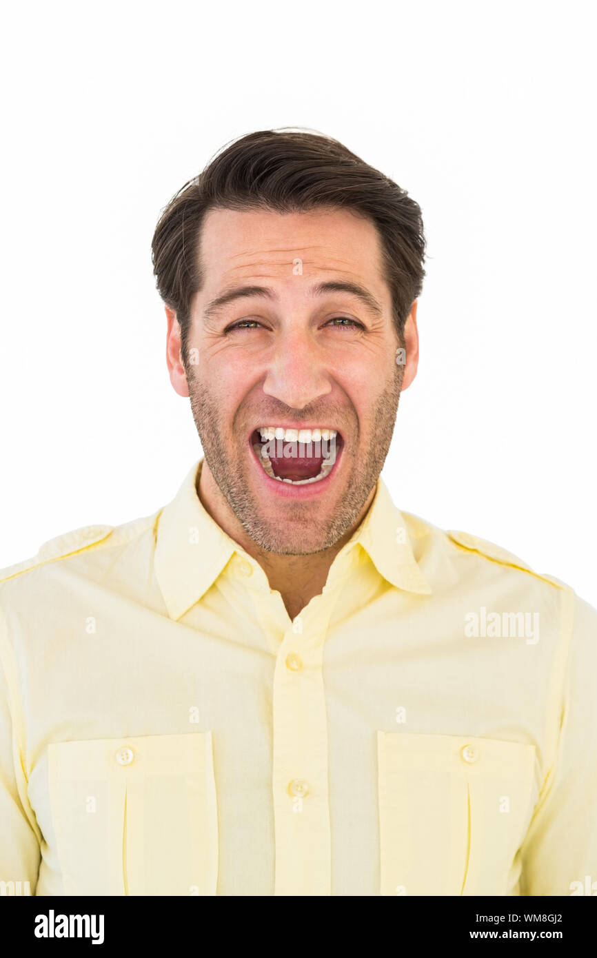 Handsome man screaming out loud on white background Stock Photo - Alamy