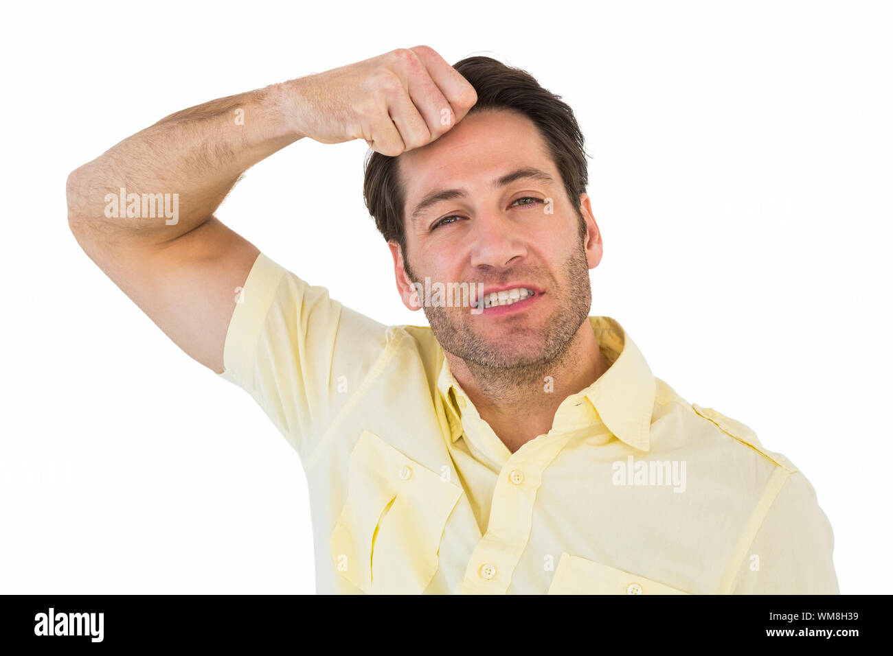 Handsome man with his hand on his forehead on white background Stock ...