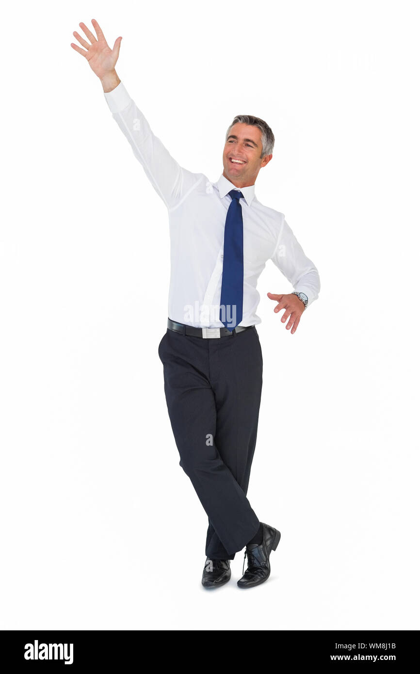Portrait of a smiling businessman waving on white background Stock ...