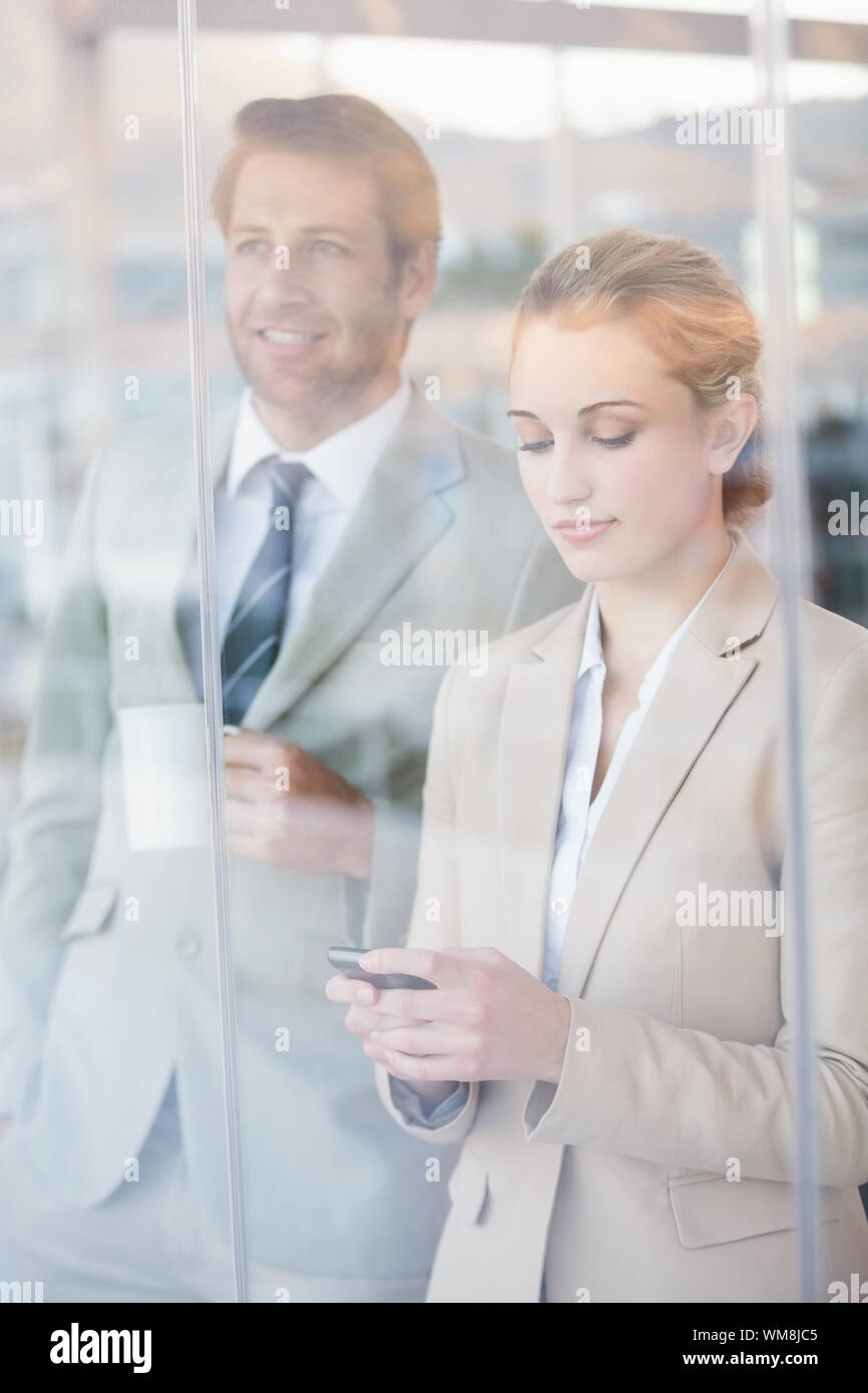 Business people looking out the window at work Stock Photo - Alamy