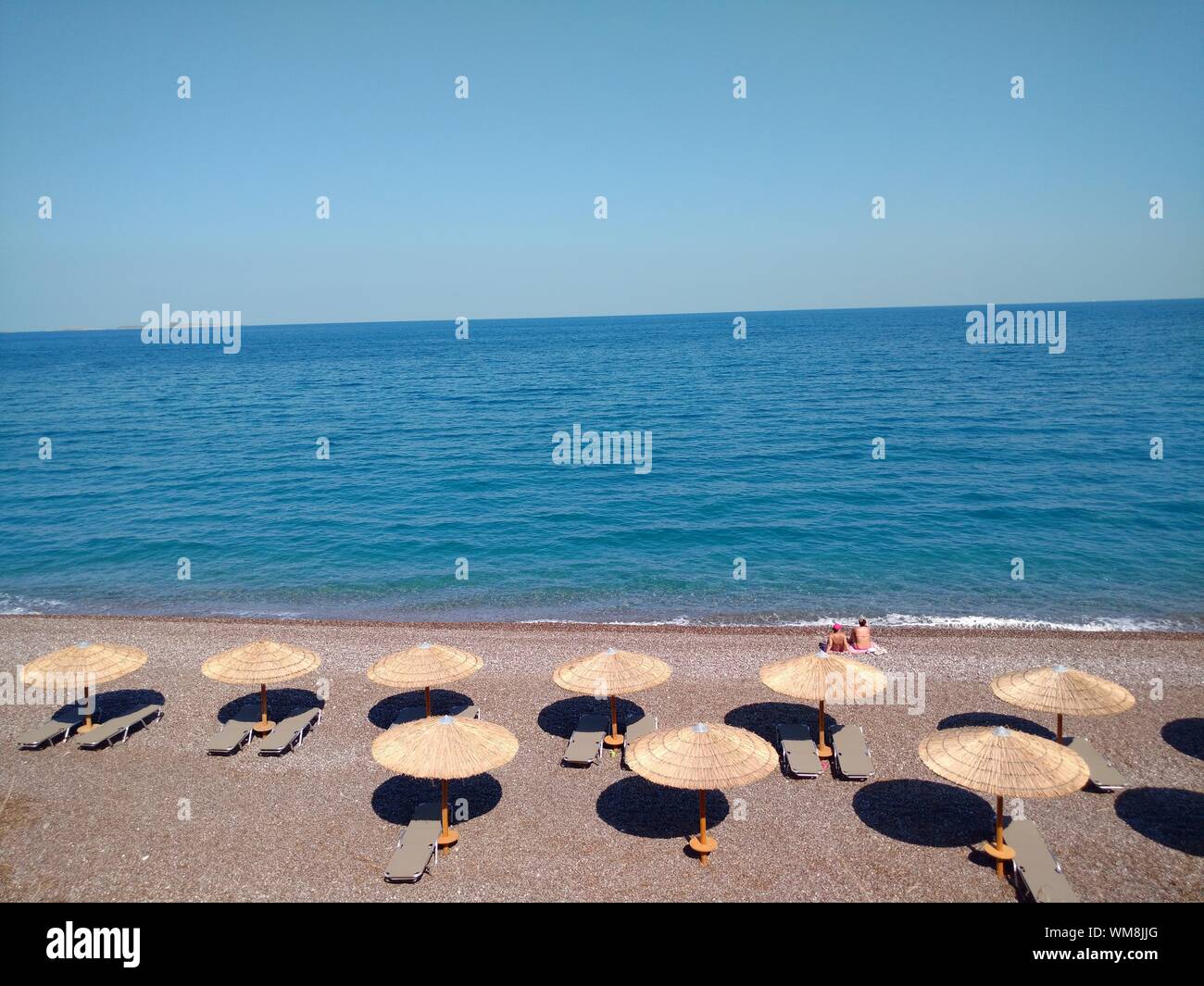 Parasols blue sky shadow hi-res stock photography and images - Alamy