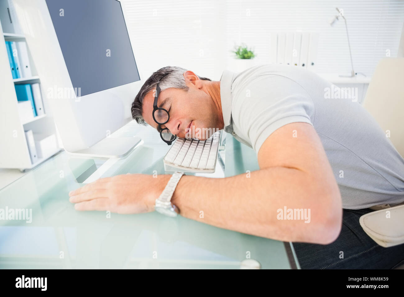 Man sleeping keyboard in computer hi-res stock photography and images ...