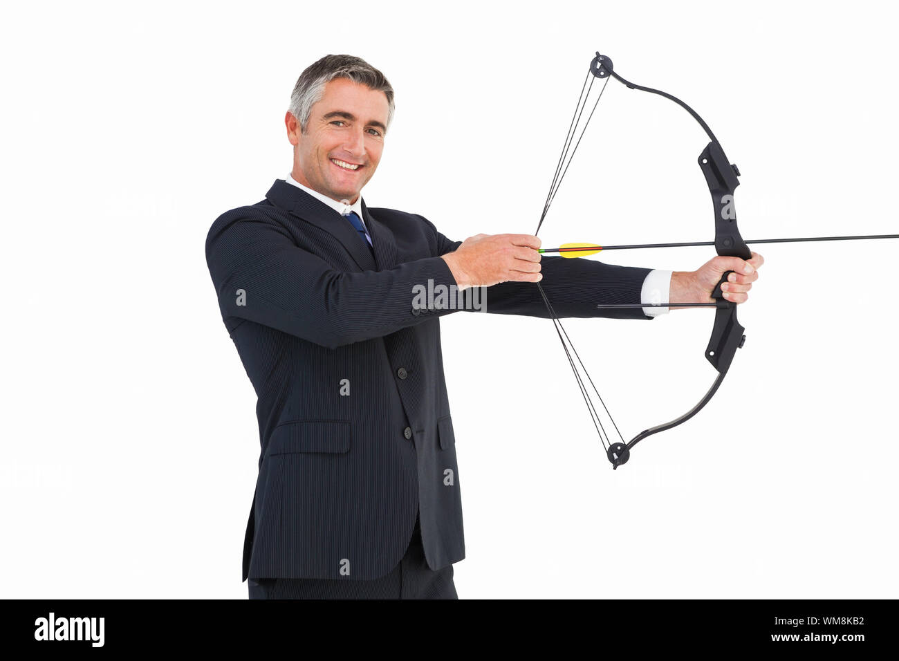Smiling businessman stretching a bow on white background Stock Photo ...