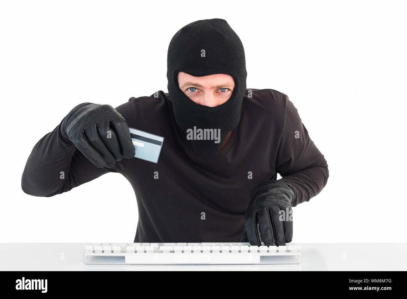 Hacker using card to steal identity on white background Stock Photo - Alamy