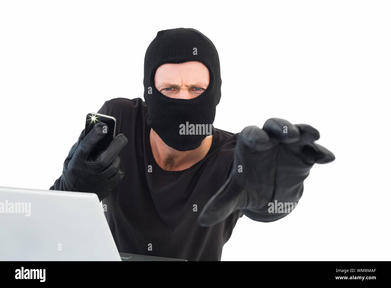 Hacker reaching out to camera on white background Stock Photo - Alamy