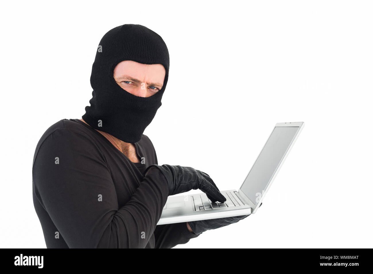 Hacker using computer man Cut Out Stock Images & Pictures - Alamy