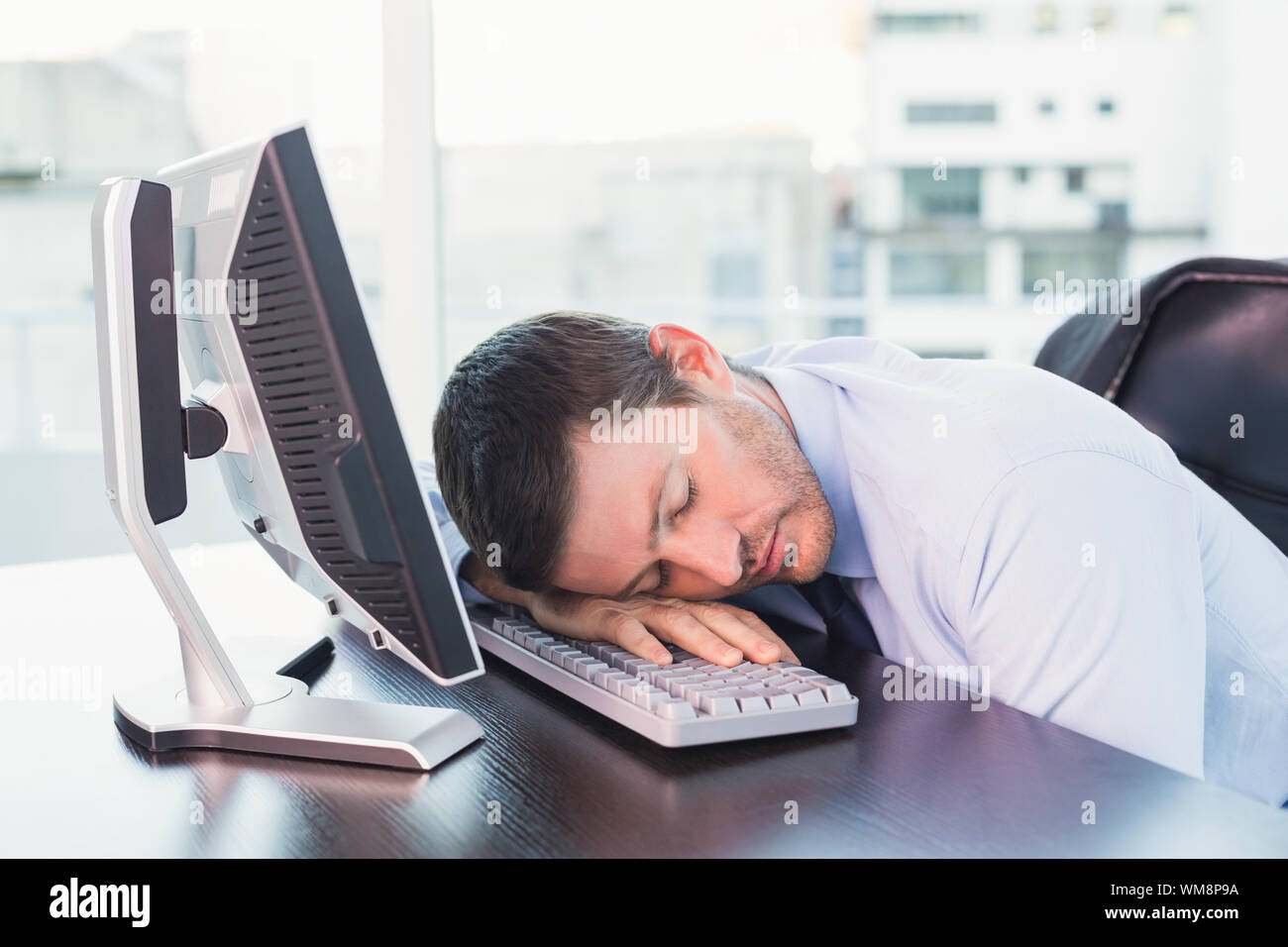 Man sleeping keyboard in computer hi-res stock photography and images ...