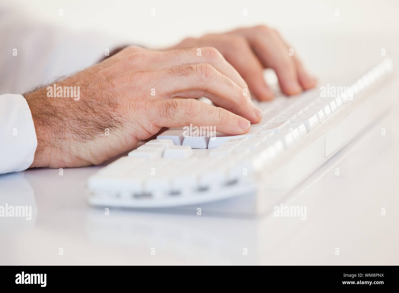 Businessman hands typing on keyboard on white background Stock Photo ...