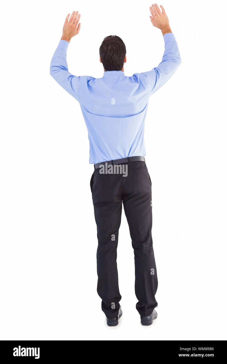Rear view of businessman raising his arms on white background Stock ...