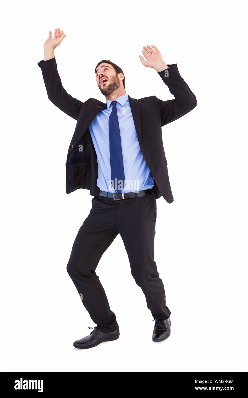 Shocked businessman standing and pushing up on white background Stock ...