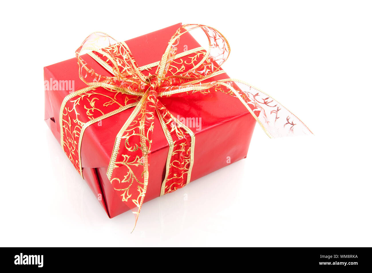 Luxury red christmas present with golden ribbon Stock Photo - Alamy