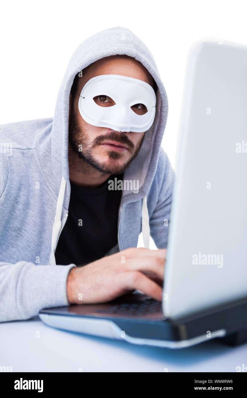 Hacker anonymous mask using laptop hi-res stock photography and images ...