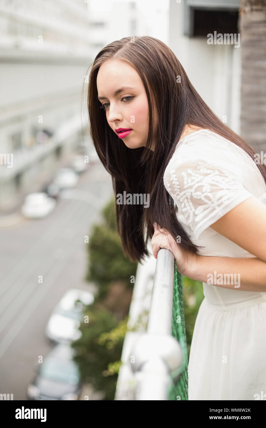 Leaning over balcony hi-res stock photography and images - Alamy