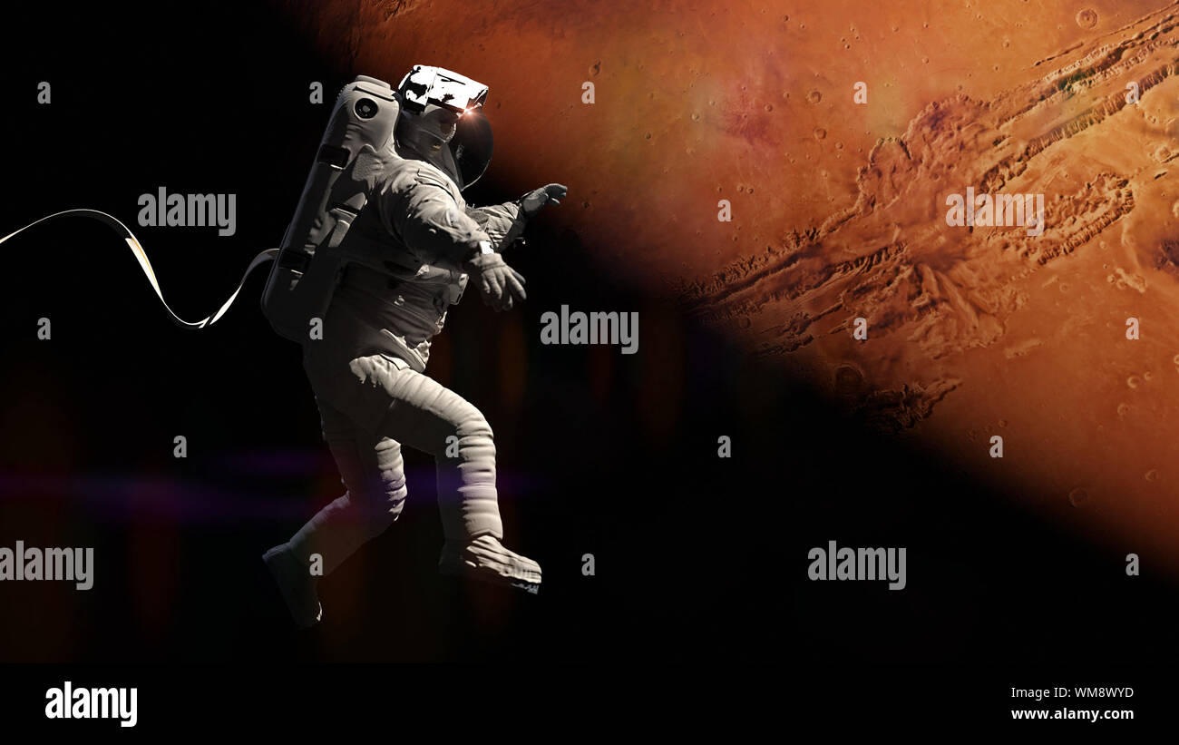 astronaut during a space walk in orbit of planet Mars Stock Photo - Alamy