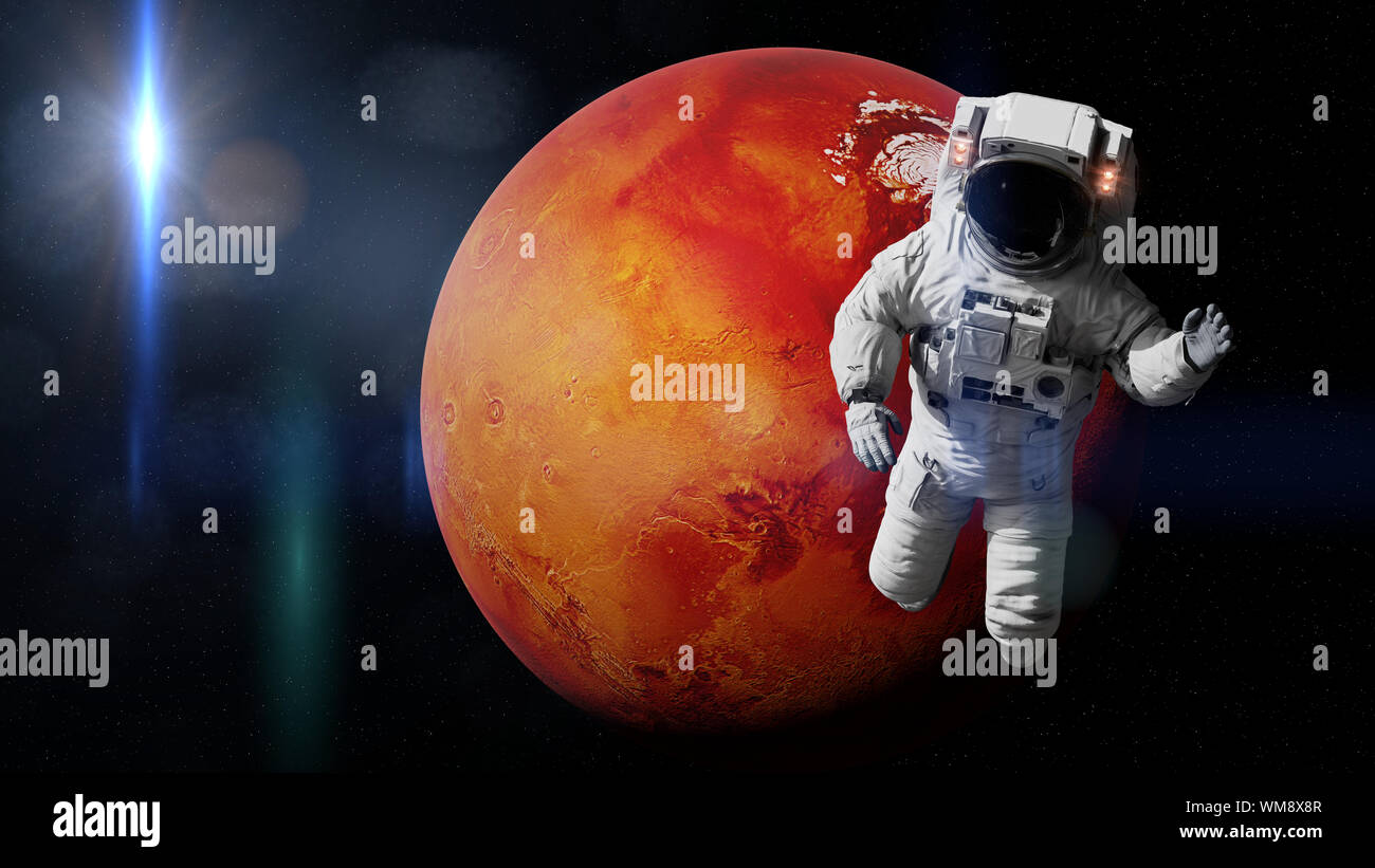 astronaut during a space walk in orbit of planet Mars Stock Photo - Alamy