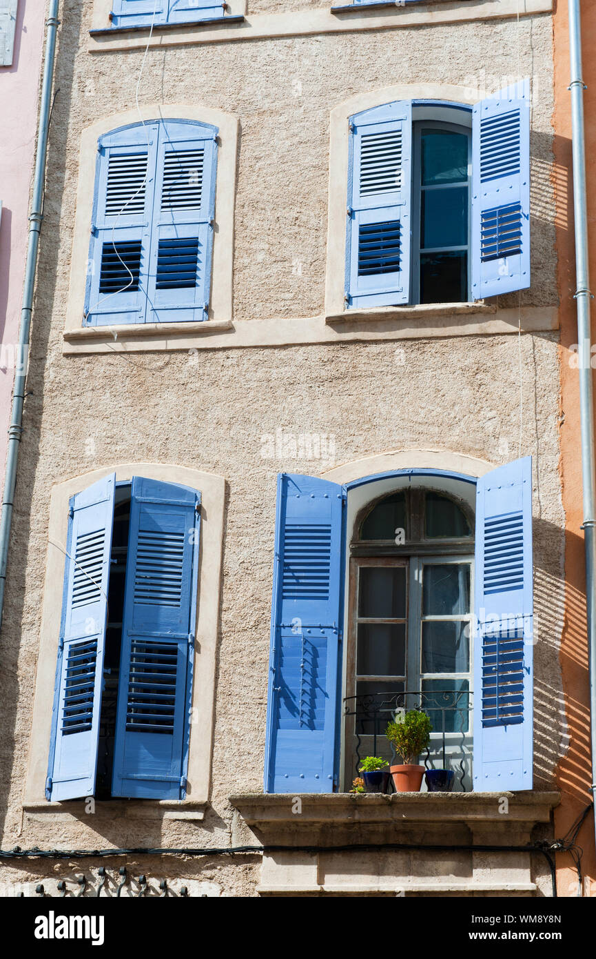Typical French facade with blue shutters at the windows Stock Photo - Alamy