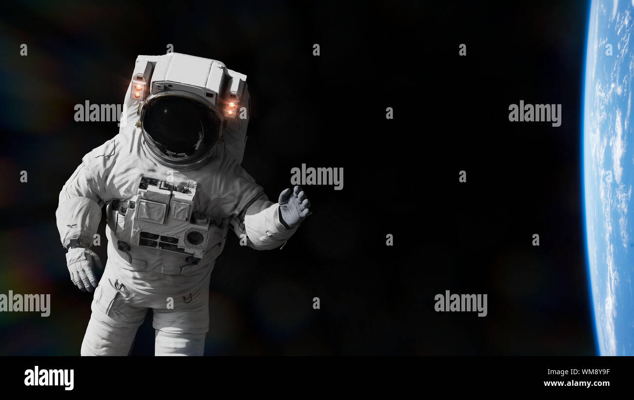 astronaut performing a space above planet Earth Stock Photo - Alamy