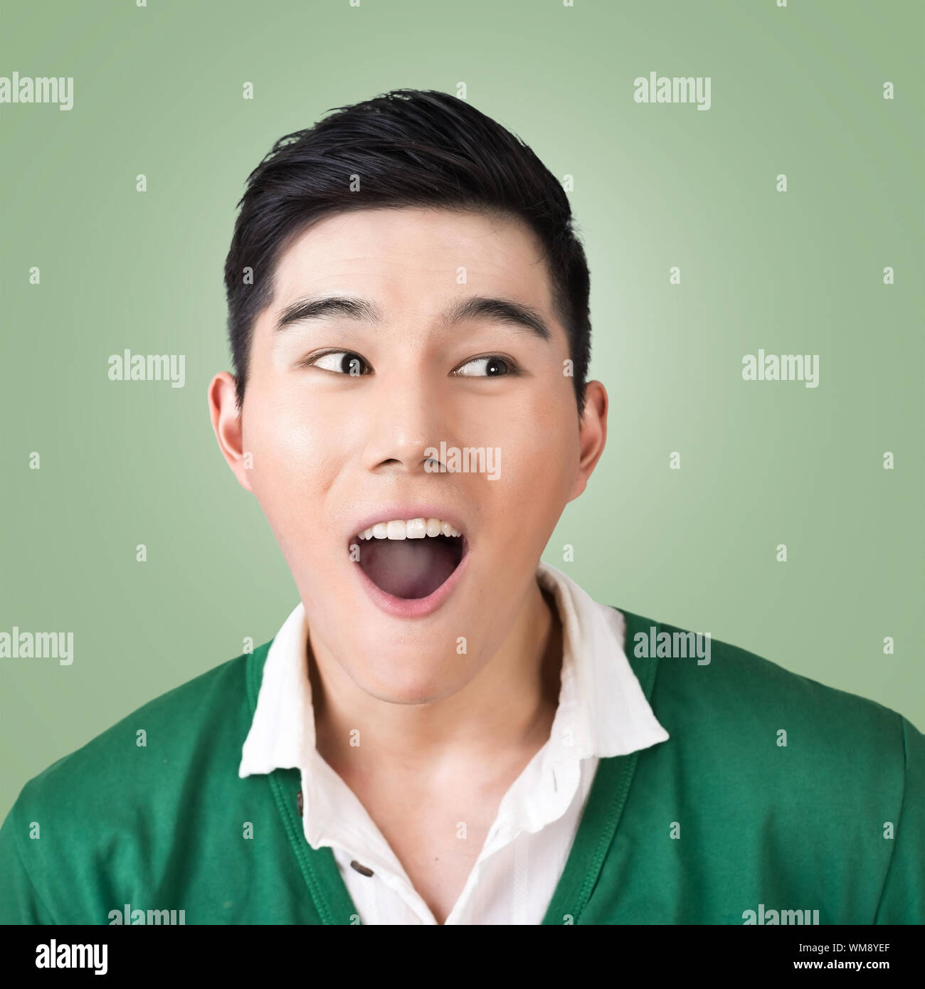 Funny facial expression, closeup Asian young man Stock Photo - Alamy