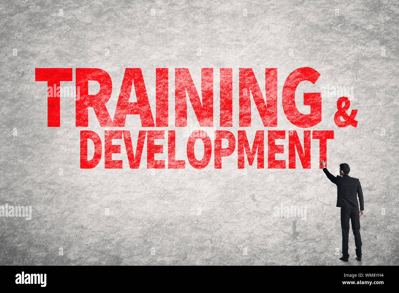 Asian business man write words on wall, Training & Development Stock ...