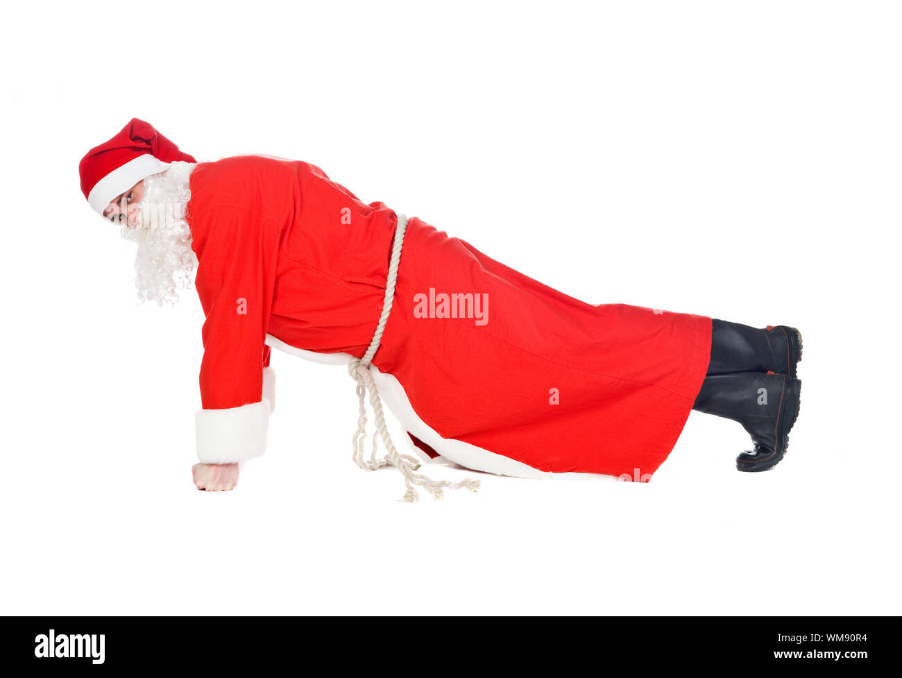 Santa claus doing push-ups isolated on a white background Stock Photo ...