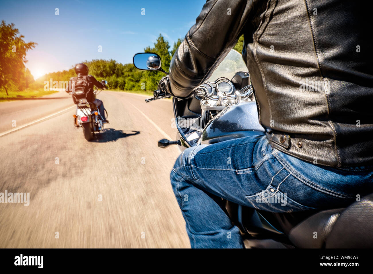 Person on motorbike riding along hi-res stock photography and images ...