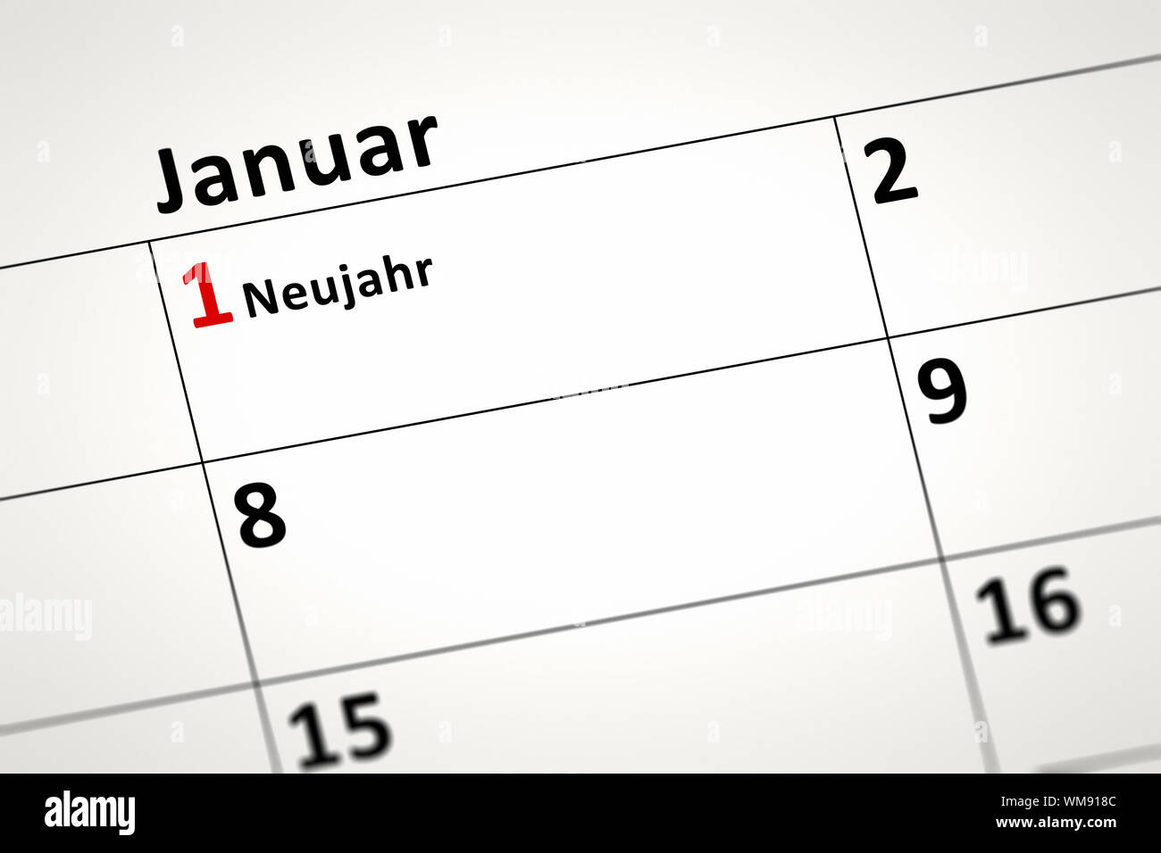An image of a calendar detail shows January the first New Year in ...