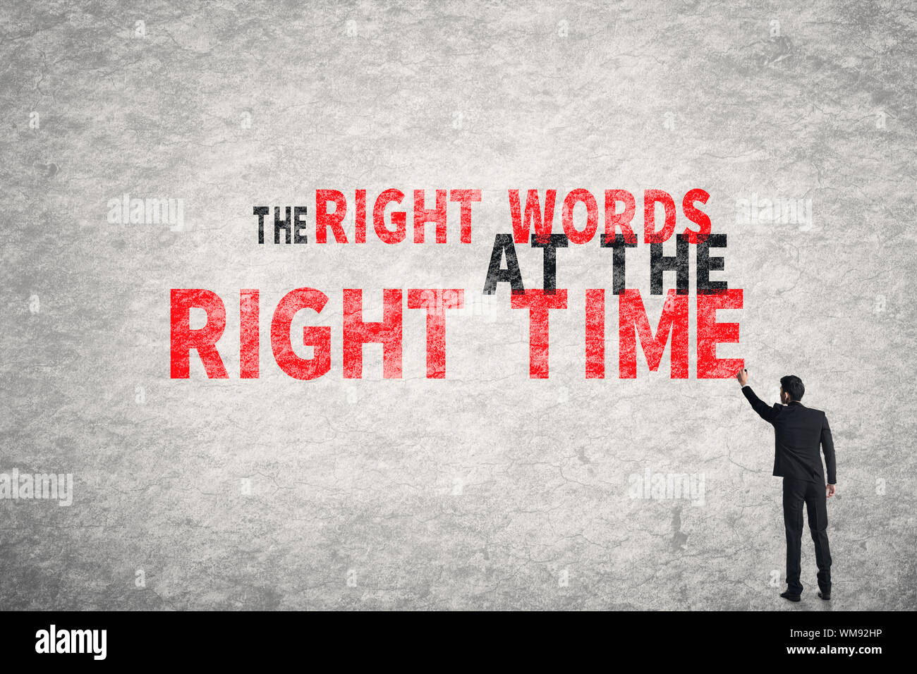 Asian businessman write text on wall, The Right Words At The Right Time ...