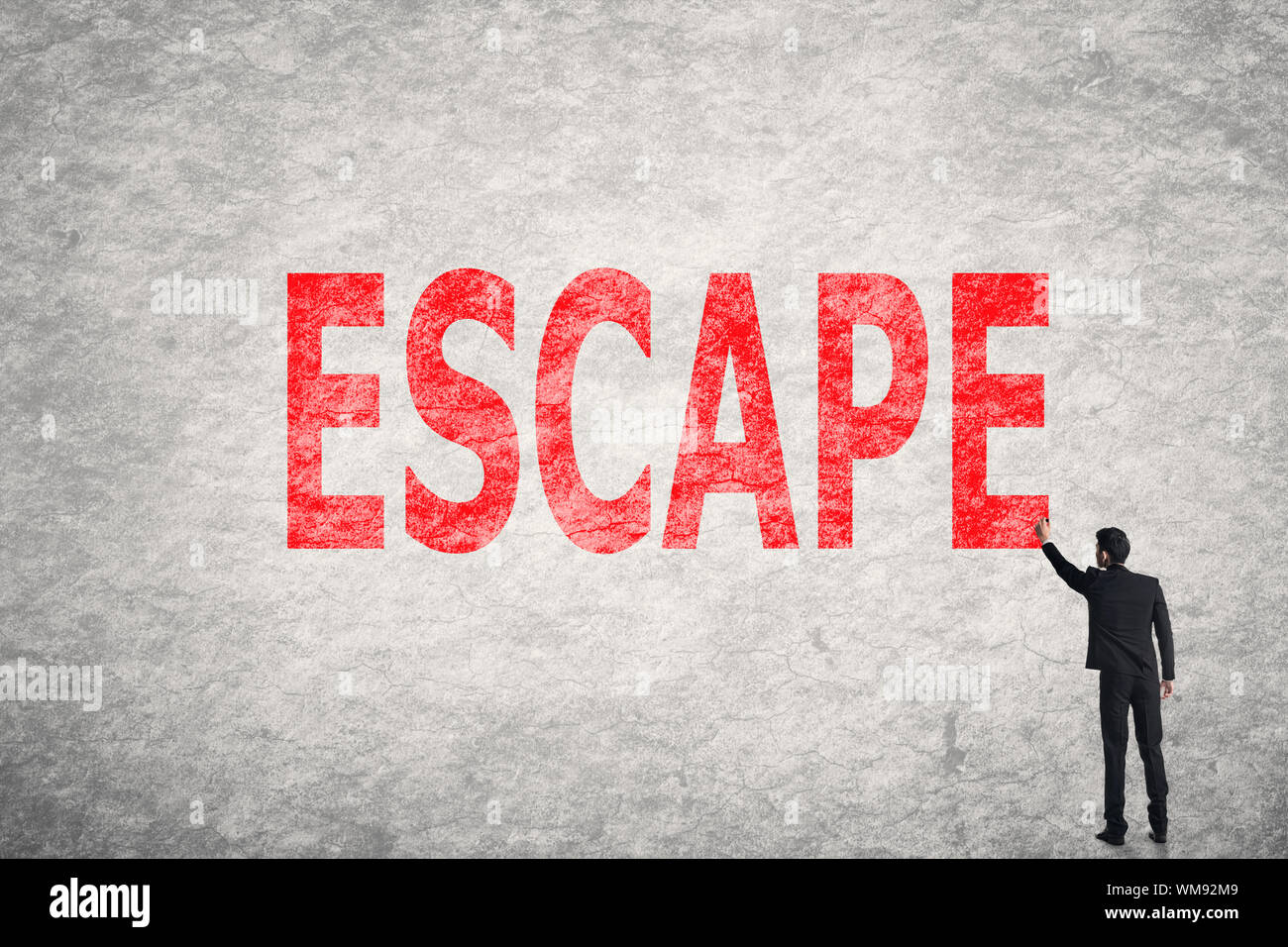 Asian businessman write text on wall, Escape Stock Photo - Alamy