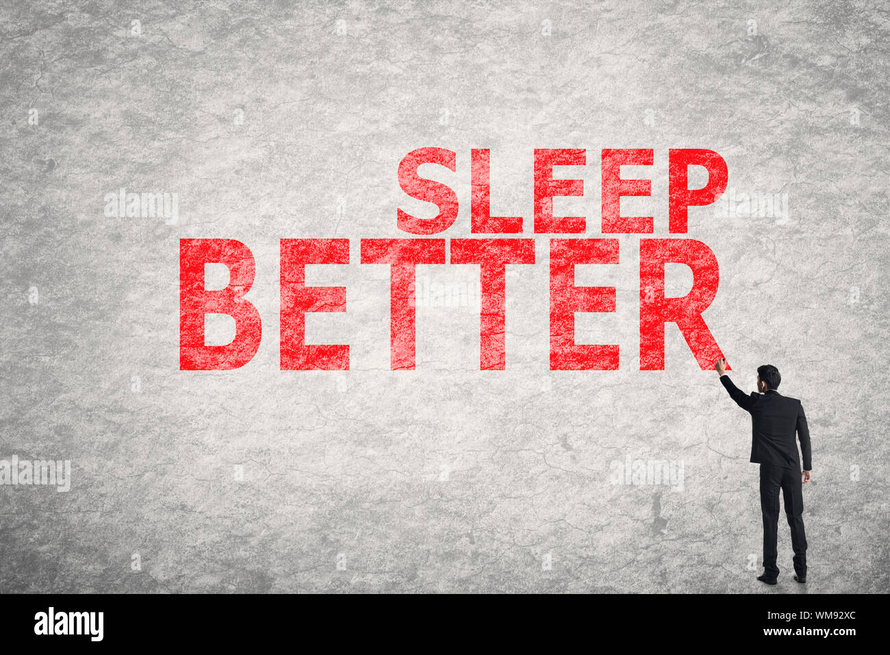 Asian businessman write text on wall, Sleep Better Stock Photo - Alamy