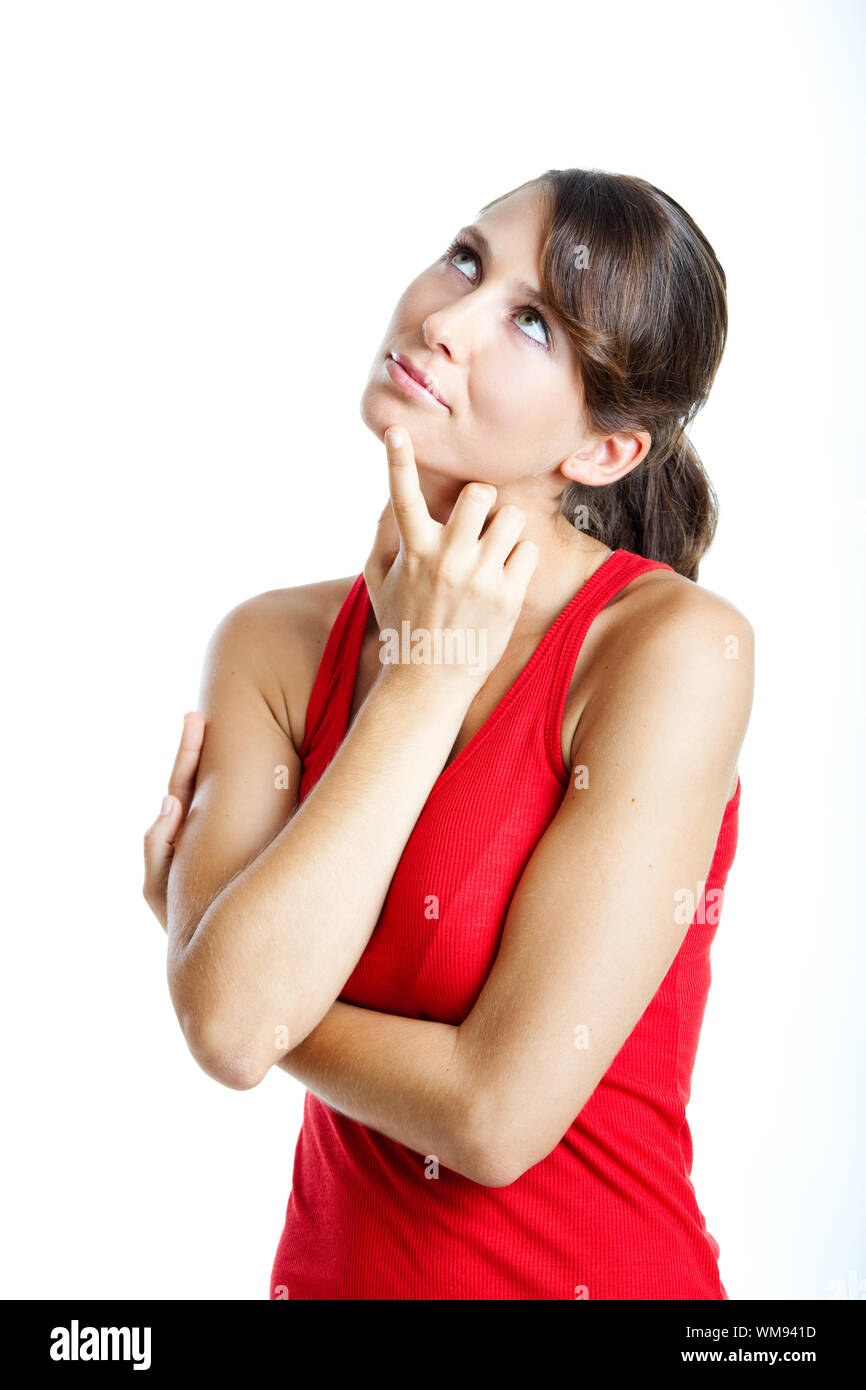 Beautiful young woman thinking on something, isolated on white Stock ...