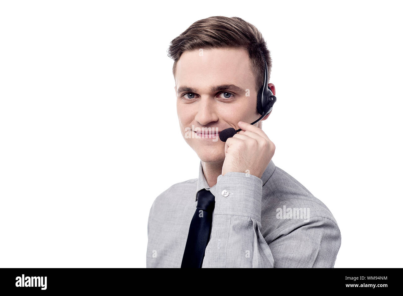 Business executive talking over his headphones over white Stock Photo ...