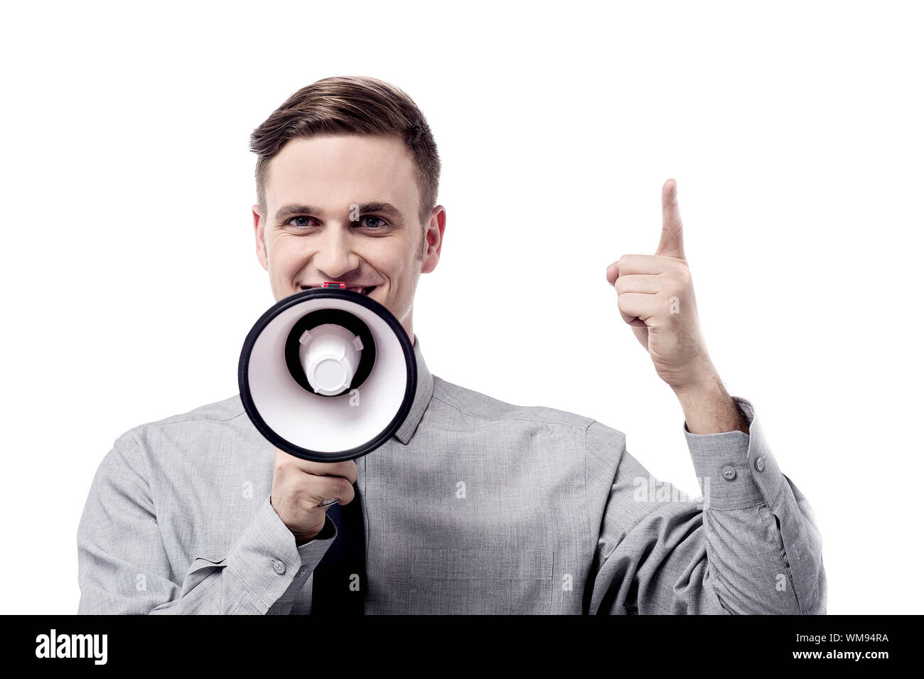 Executive making an announcement over loudhailer Stock Photo - Alamy