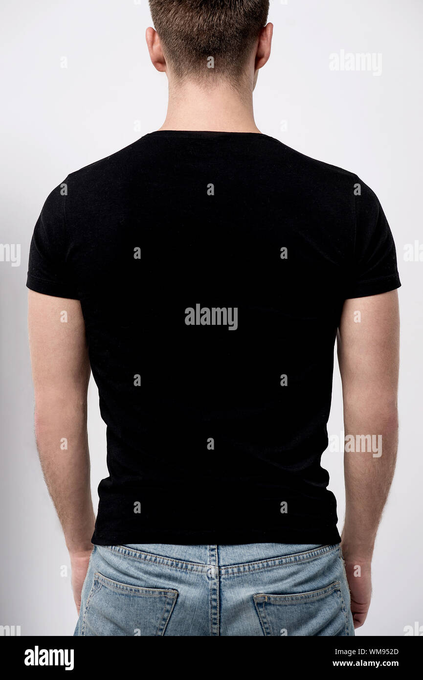 Casual man from the back, facing the wall Stock Photo - Alamy
