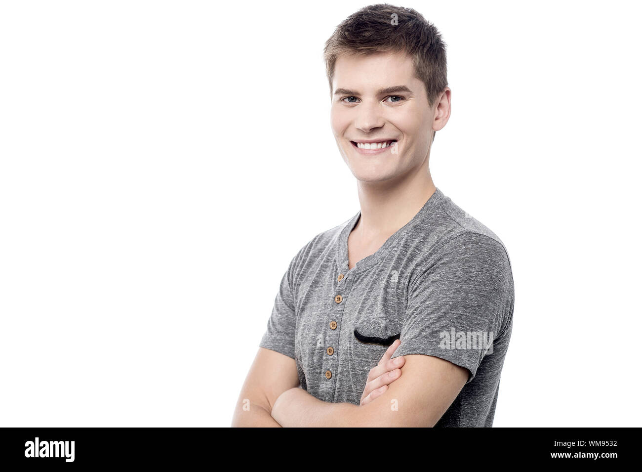Side pose of young man looking at camera Stock Photo - Alamy