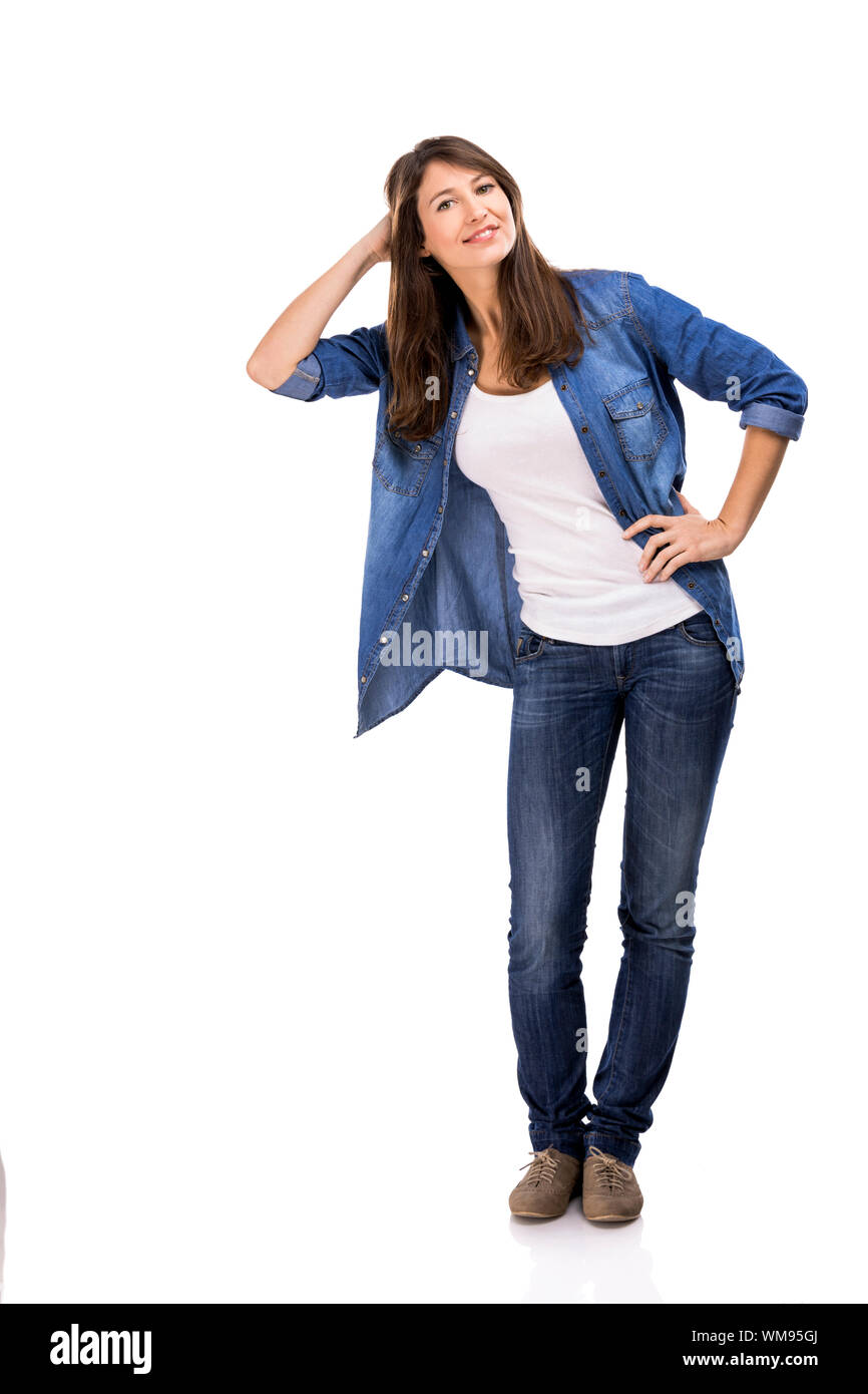 Beautiful woman standing over a white background with copyspace for the ...