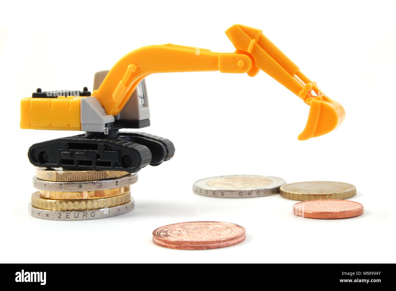 making euro money coins with digger isolated on white background Stock ...