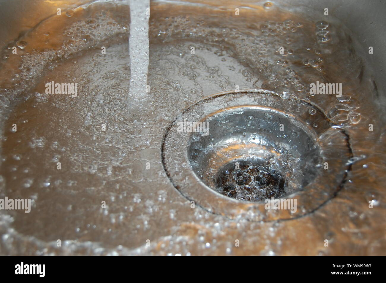water flow into the drain in the kitchen Stock Photo - Alamy